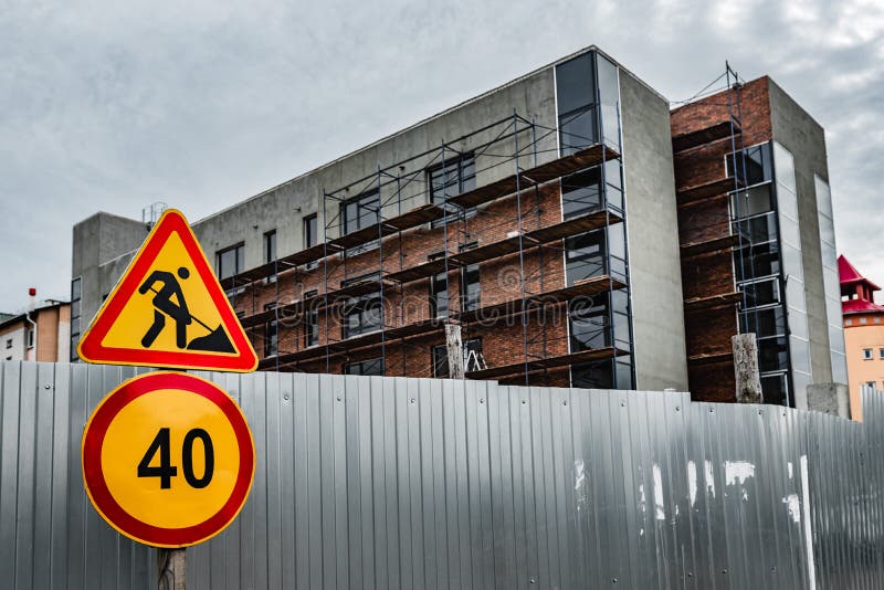 Sign `repair Work` and `speed Limit` on Background of Construction of a ...