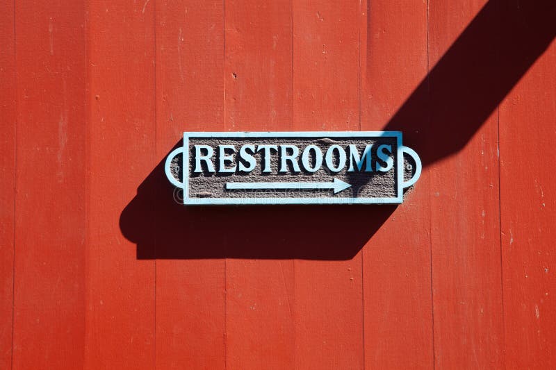 Sign Restroom at a Red Wall with Shadow Stock Image - Image of shadow ...