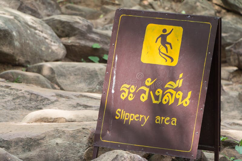 Sign Showing A Slippery Area. Stock Photo - Image of prevent, sign ...