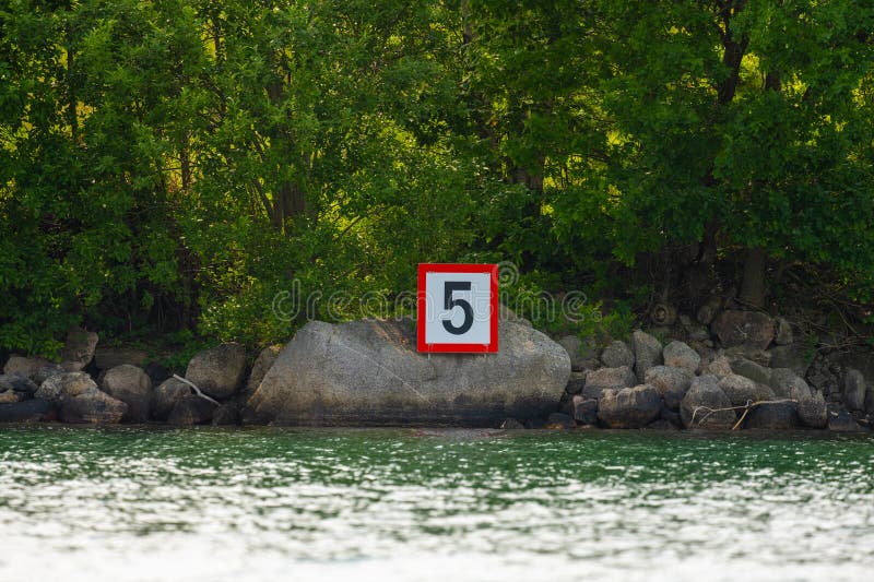 Sign Showing Speed Limit of 5 Knots at Sea.. Stock Photo - Image of ...