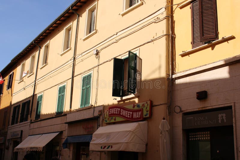 A Sign on the Side of a Building Editorial Image - Image of girl, happy ...