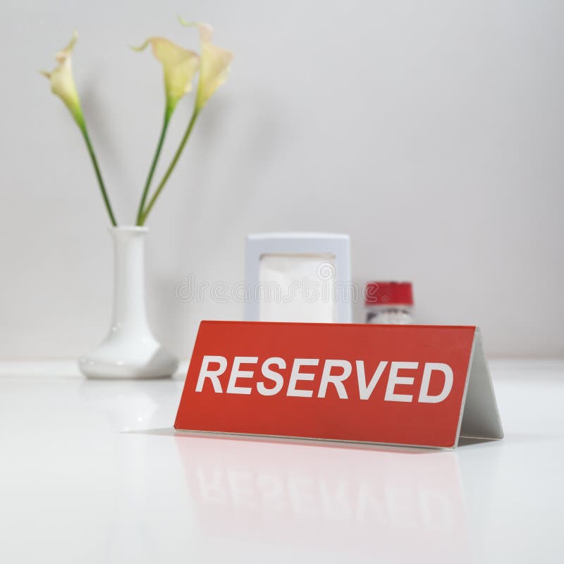 Sign on the table Reserved stock image. Image of preparation - 63076019