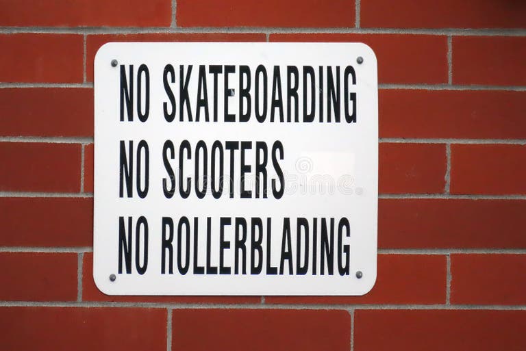 A Sign with the Text No Skateboarding, No Scooters, No Rollerblading on ...