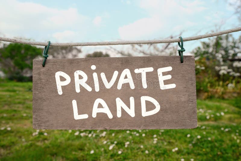 Sign with Text Private Land Hanging on Rope Outdoors Stock Image ... Sign with Text Private Land Hanging on Rope Outdoors Stock Image ...
