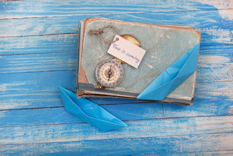 Sign Time is Coming and Compass on Old Book - Vintage Style Stock Image ...