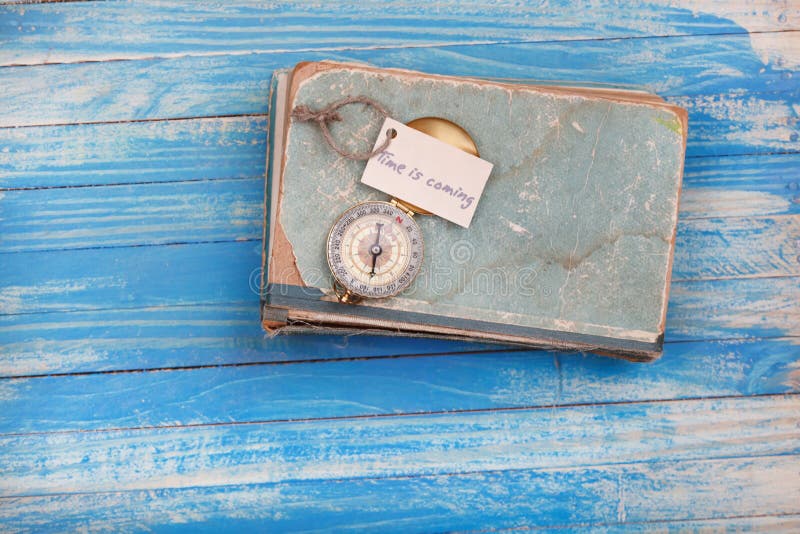 Sign Time is Coming and Compass on Old Book - Vintage Style Stock Image ...