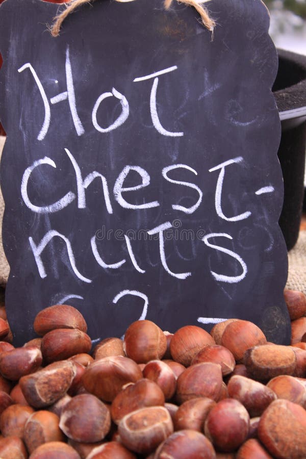 Sign to sell hot chestnuts stock image. Image of white - 17488415