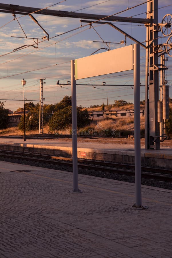 Sign at the Train Station during the Morning, Train Tracks. Empty Sign ...