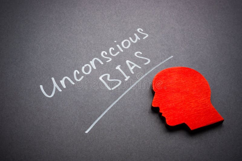 Sign Unconscious Bias on Dark Surface and Head Shape. Stock Photo ...
