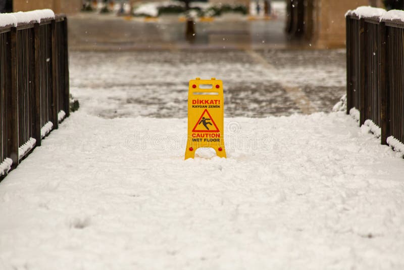 A Sign Warning of Slippery Ground on Snow Stock Photo - Image of safety ...