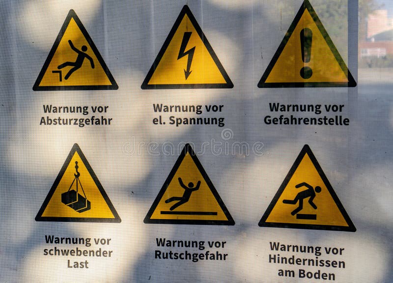 A Sign with a Yellow Triangle and a Black Border with the Word Warning ...