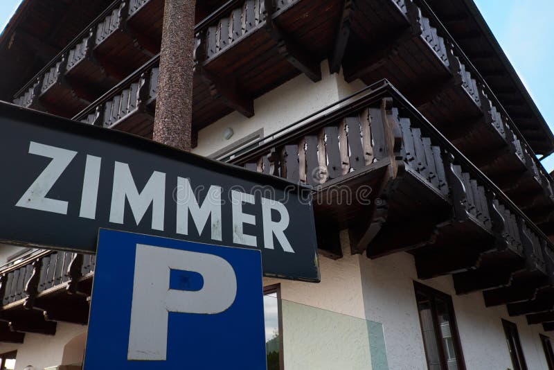Sign Zimmer with Chalet Background in Alps Stock Image - Image of ...