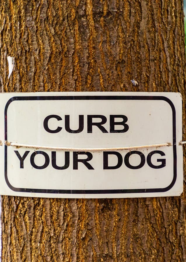 Signage Warning Dog Owners To Curb Their Pets Stock Photo - Image of ...