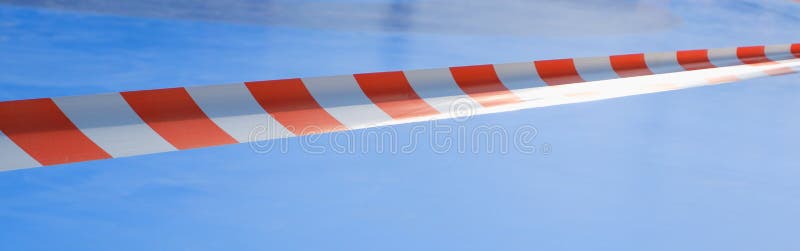 Signal Red-white Tape on a Blue Background. Red and White Warning Tape ...