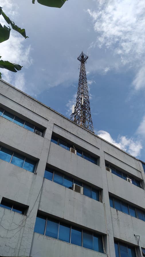 A Signal Transmitting Tower on Top of an Office Building Stock Photo ...