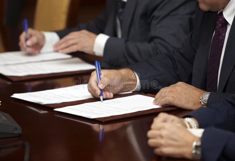 Signing of official papers stock image. Image of human - 10652329