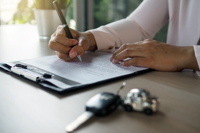 Signing of a Car Purchase Contract. New Car Owner Stock Photo - Image ...