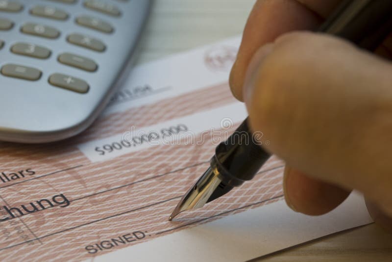 Signing a check cheque stock image. Image of cheque, demand - 10296363