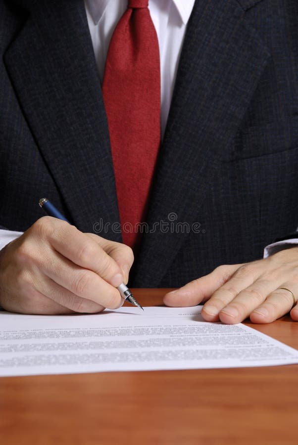 Signing a contract stock photo. Image of signature, contract - 4570042