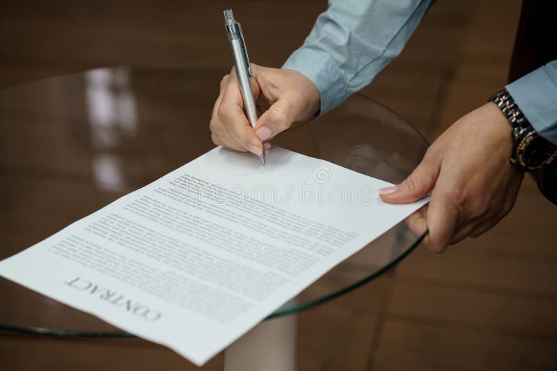 Signing a Contract on a Glass Table Stock Photo - Image of paperwork ...