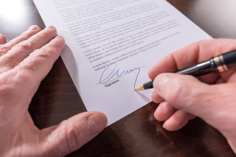Signing of a contract stock photo. Image of paper, signature - 78372788