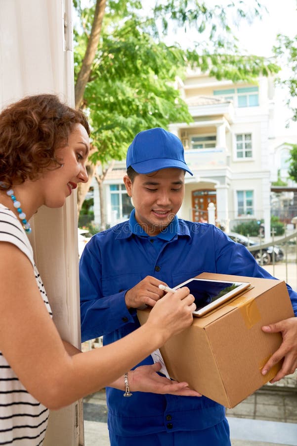 Signing delivery document stock photo. Image of tablet - 135269146