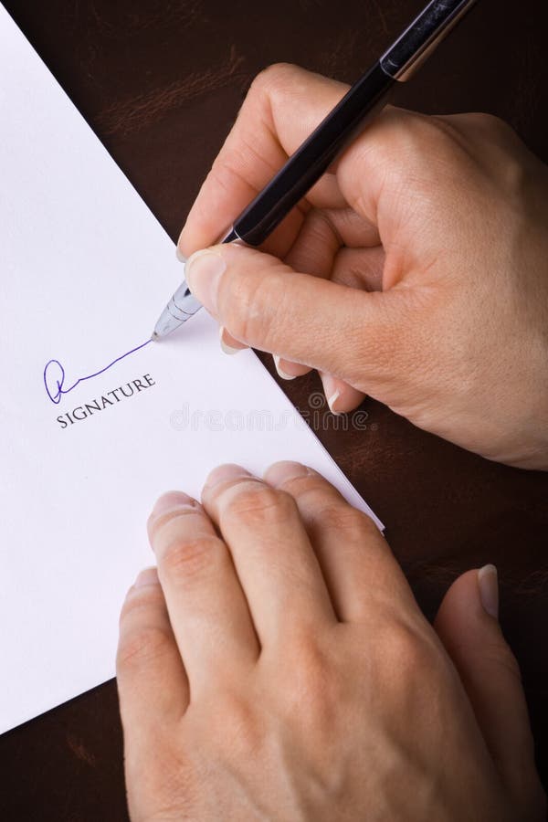 Signing a document stock photo. Image of closeup, desk - 27307902