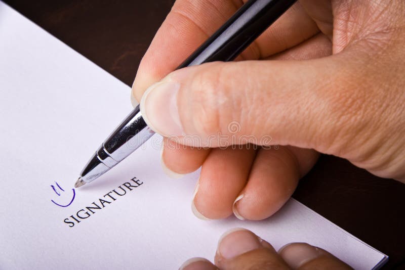 Signing a document stock photo. Image of handwriting - 27307934