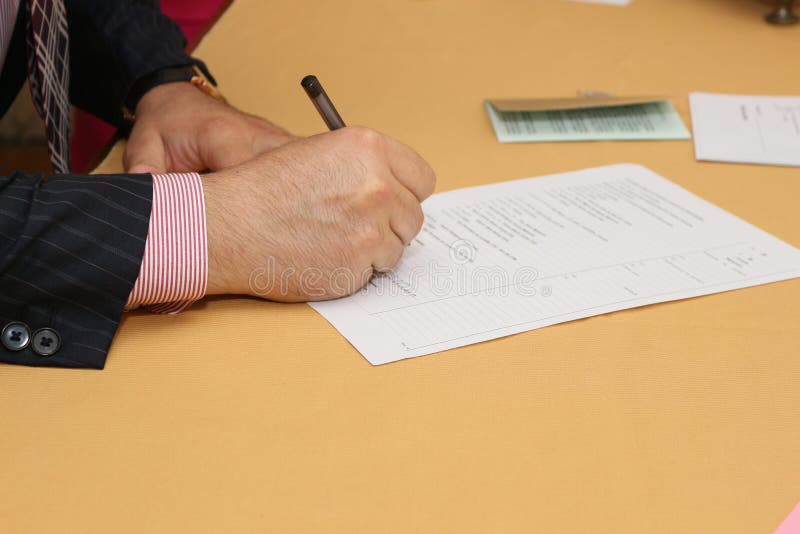 Signing of official papers stock image. Image of human - 10652329