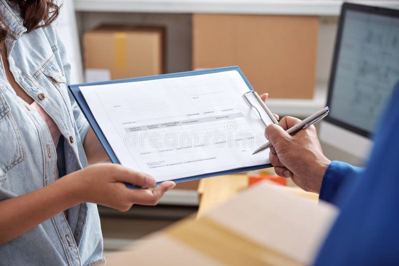 Signing document stock photo. Image of package, deliveryman - 137076158