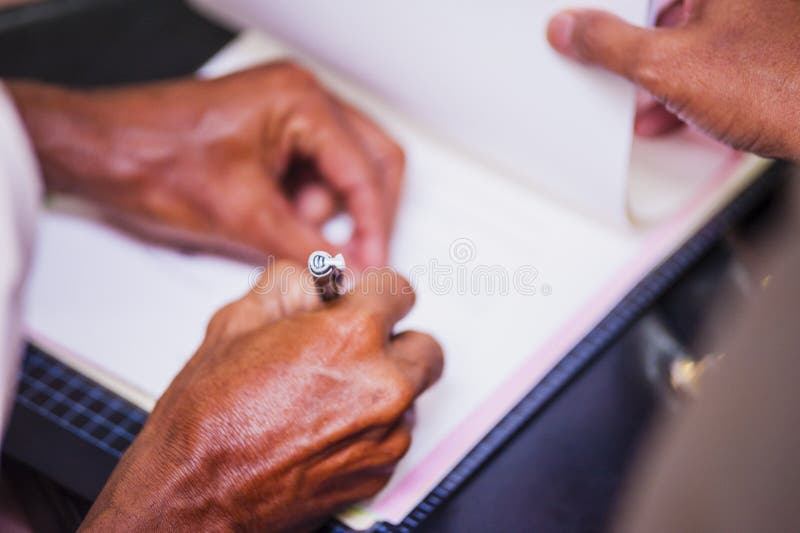 Hand Signing a Document in Ink on Sign Here Line Stock Photo - Image of ...