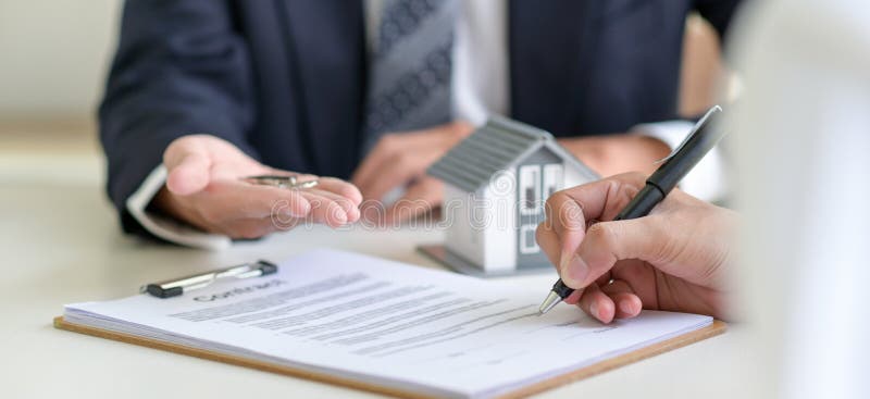 Signing a Loan for a Home Purchase Stock Photo - Image of property ...