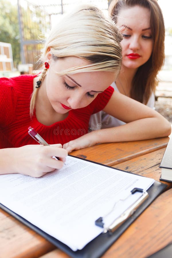 Signing a model release stock image. Image of fall, girls - 34428187