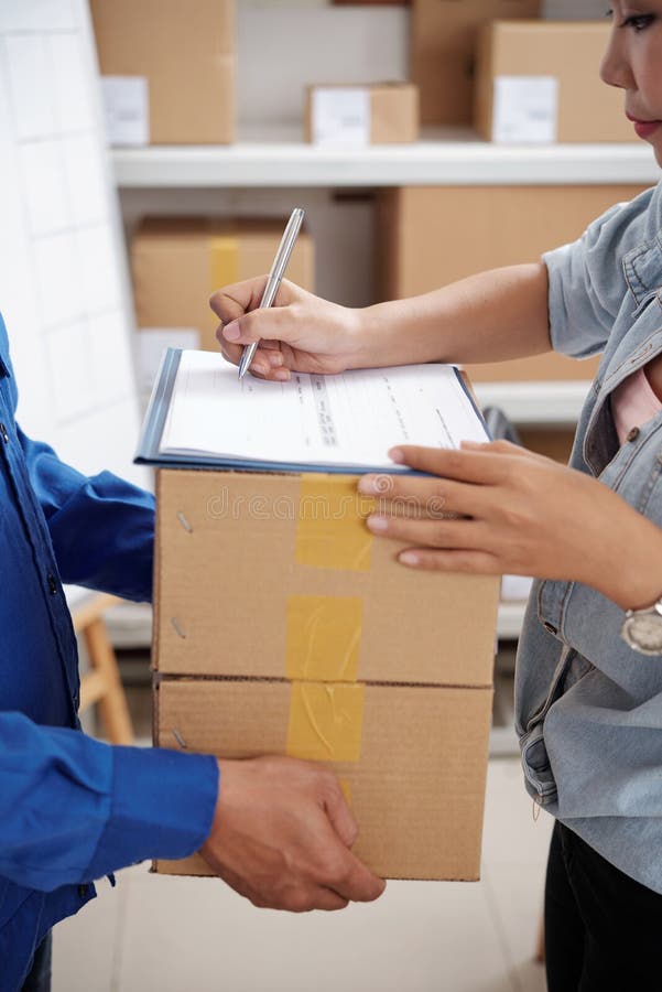Signing parcel documents stock image. Image of shipment - 127950635