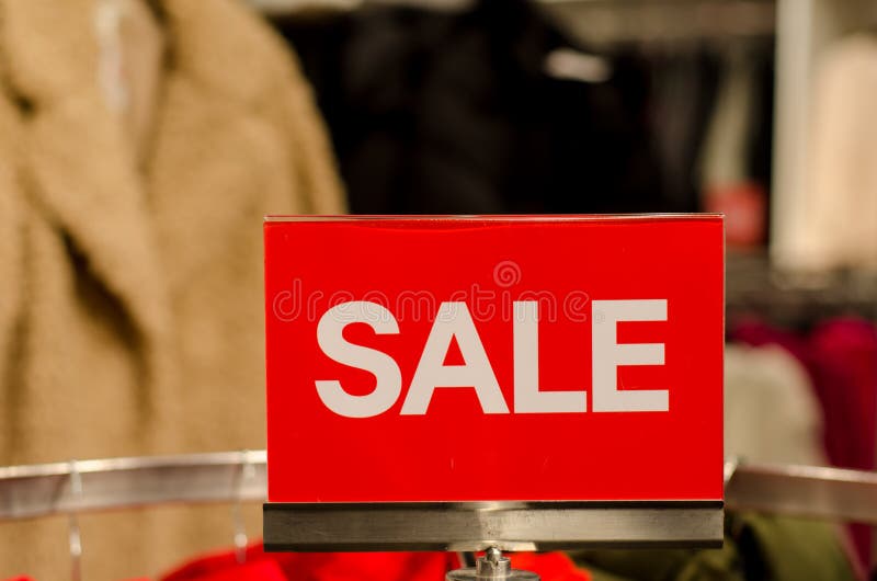 Sale Signs on Paper Bags in Display Window of Clothing Store Stock ...