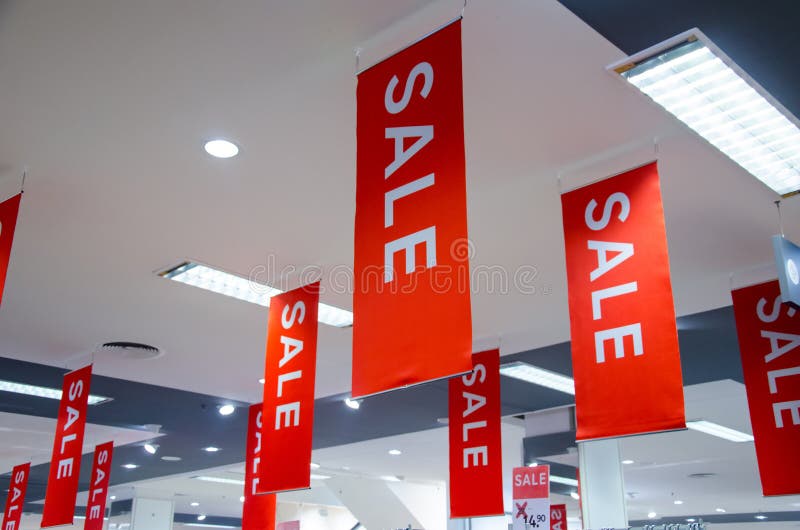 Signs of sale in the store stock photo. Image of customer - 142273928