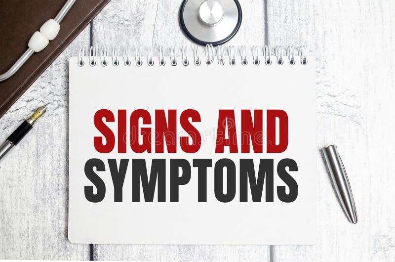 Signs and Symptoms Words on with Sticker Near Red Notebook with ...