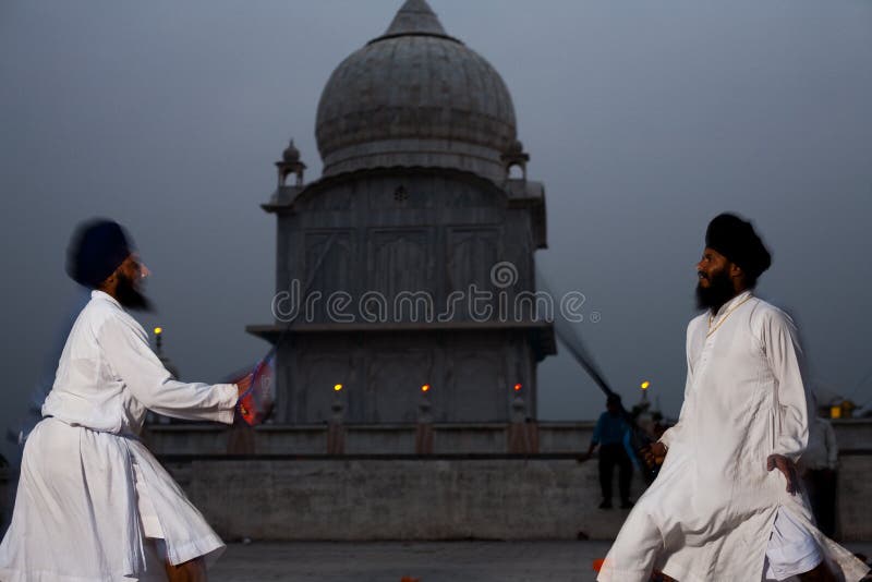 Sikh Men Duel Swords editorial stock image. Image of guys - 17273119