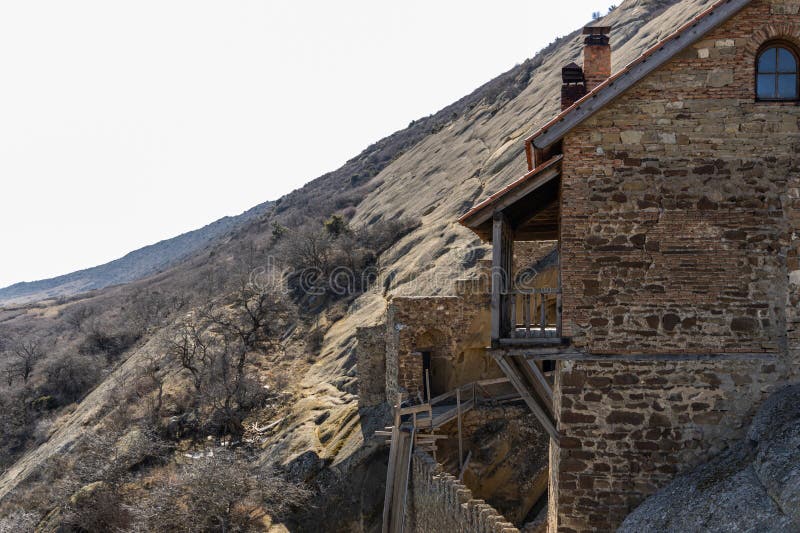 Silent Sanctuary: Stone Building Perched on Mountain Precipice Stock ...