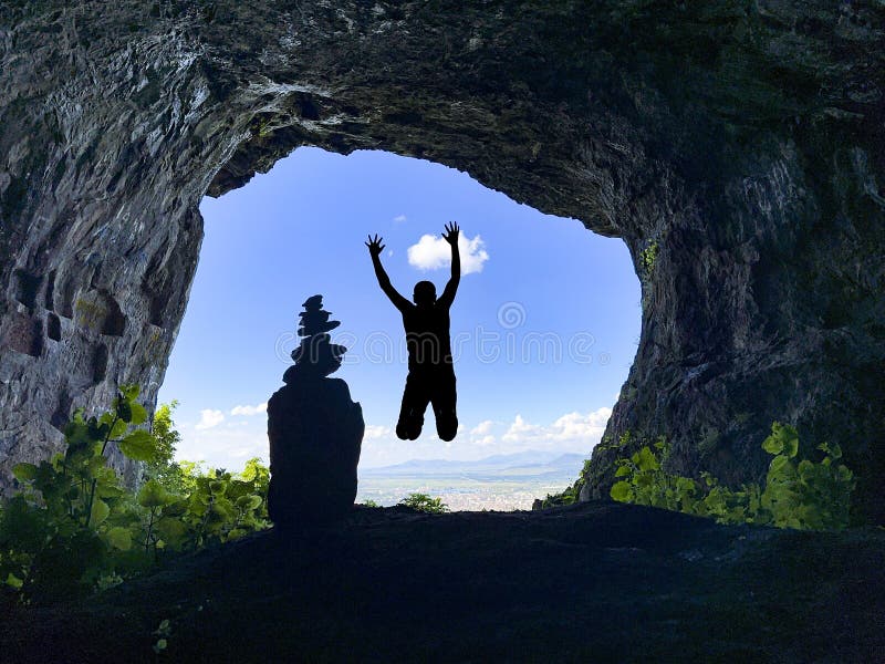 Silhouette of Active and Energetic Young Man in Cave at Peak Stock ...