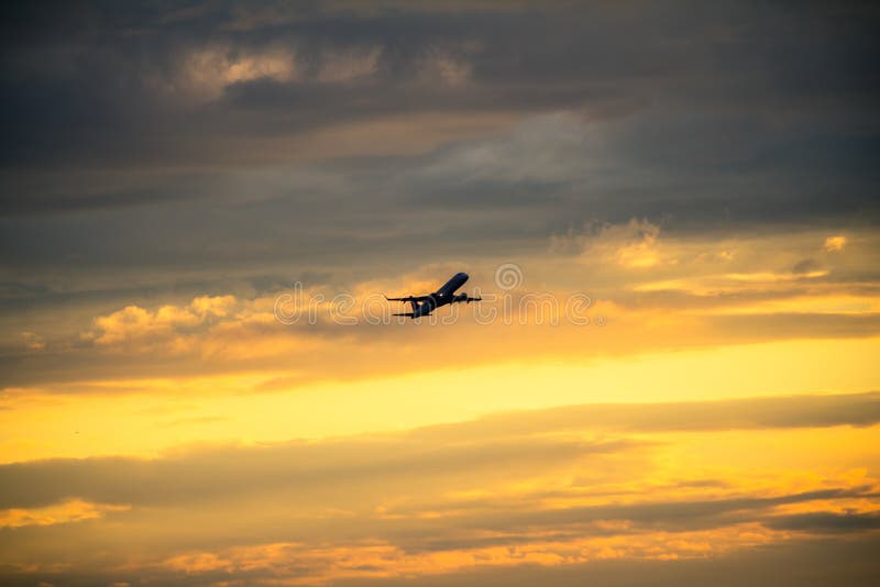Silhouette of Airplane at Sunset Stock Photo - Image of bright, black ...