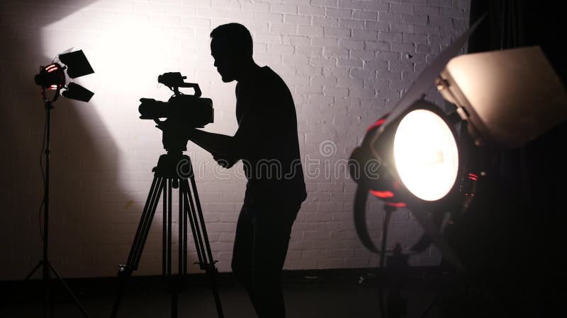 Silhouette of Cameraman Working Behind the Scenes in Film Studio Stock ...