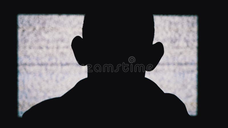 Anonymous Man in a White Mask Covering His Face and a Black Hood Turns ...