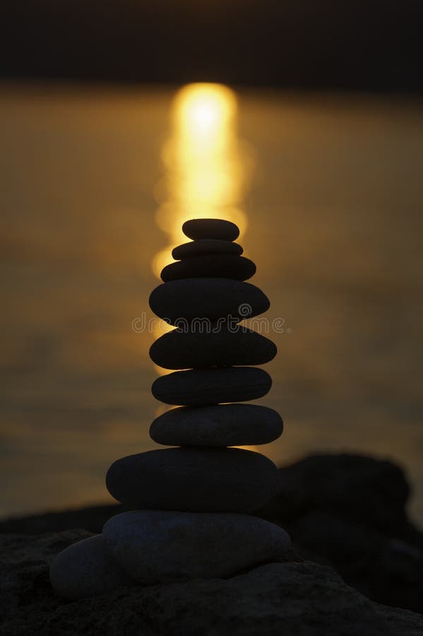 Silhouette of Balanced Stack Pebbles Stock Image - Image of colorful ...