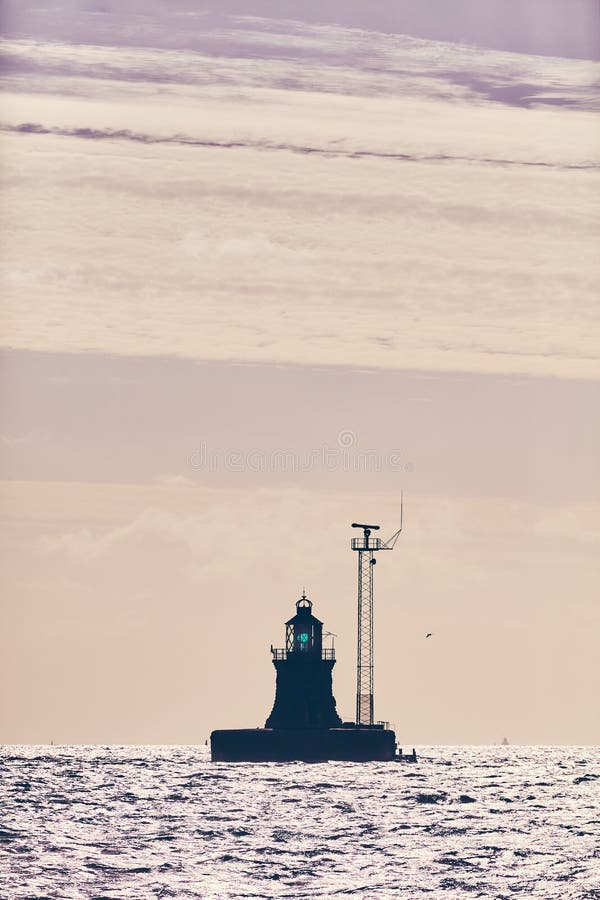 Silhouette of a Beacon at Sunset Stock Photo - Image of solitude, ocean ...