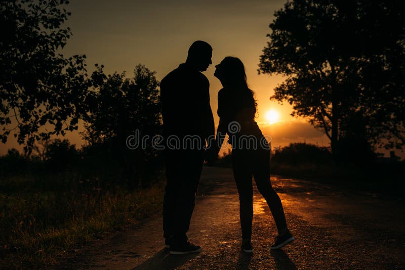 Silhouette of Beautiful Couple on the Sunset Stock Image - Image of ...