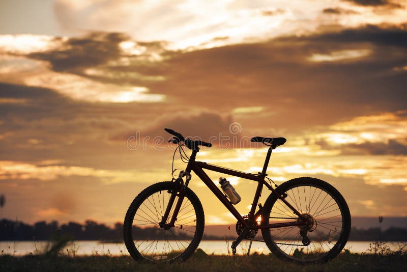 Bicycle at the Sunset or Sunrise Stock Image - Image of field ...