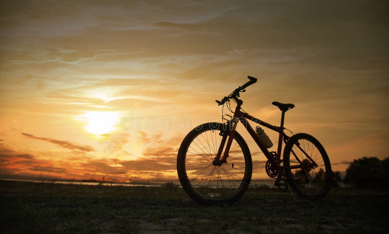 Bicycle at the Sunset or Sunrise Stock Image - Image of field ...