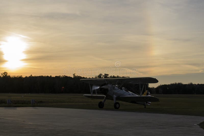 Silhouette of Biplane about To Land during Sunset Stock Photo - Image ...