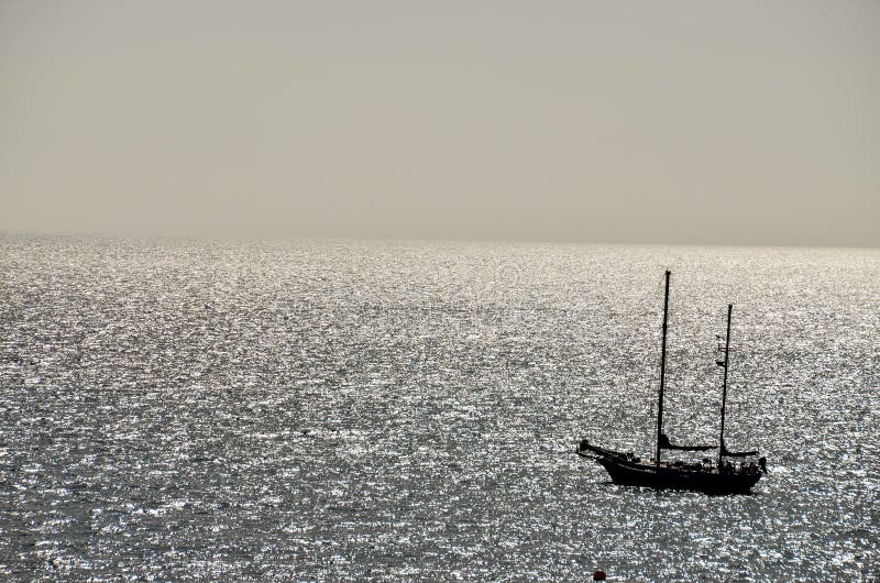 Silhouette Boat in the Ocean Stock Photo - Image of tropical, peaceful ...